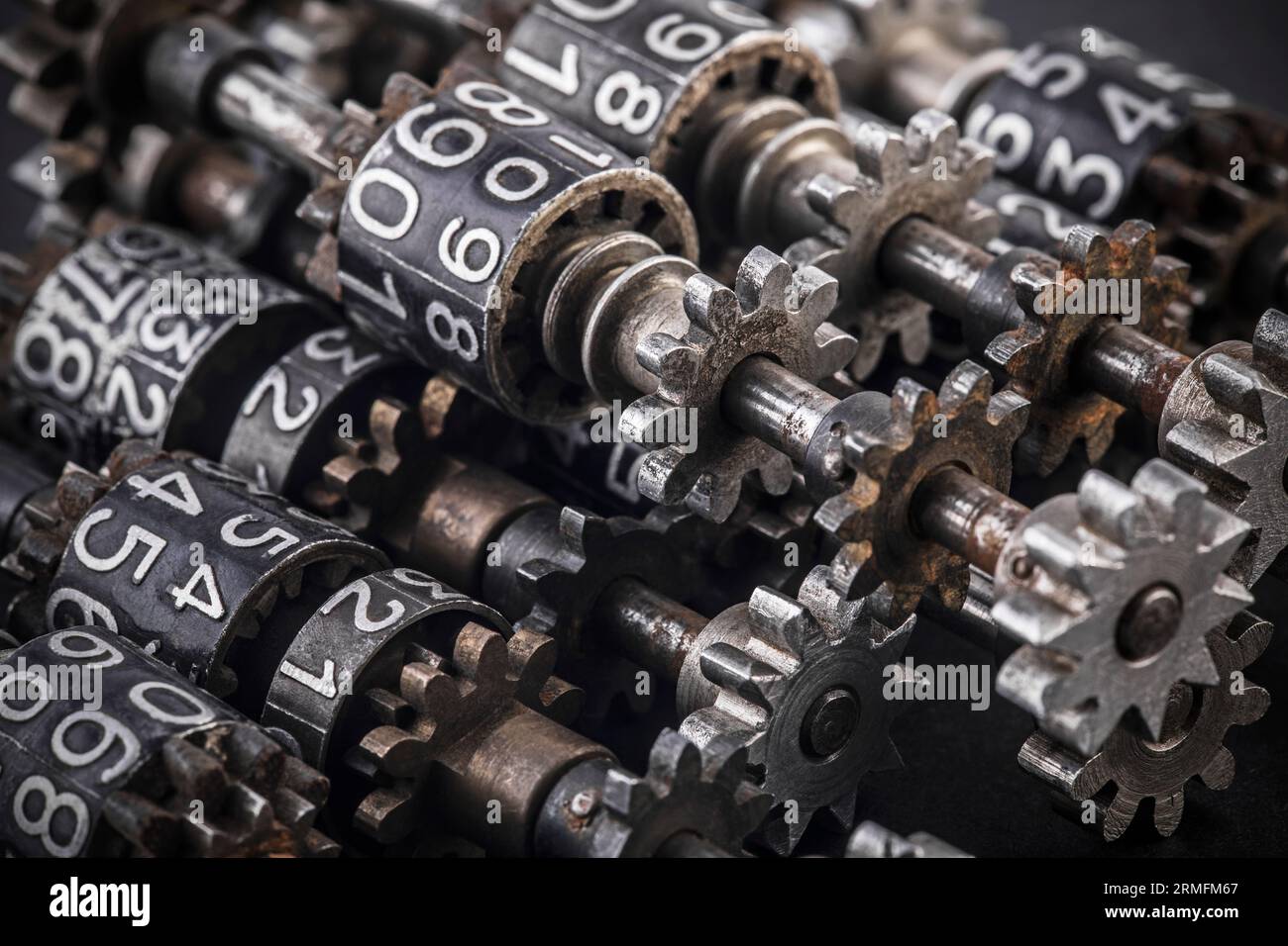 Metal gears and cogs mechanism with numbers Stock Photo - Alamy