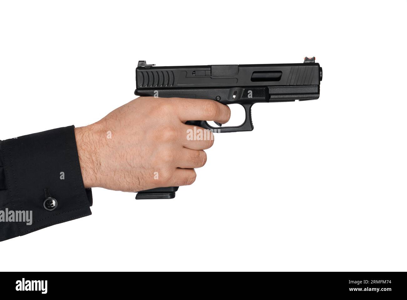 Close up of short-barrelled handgun, typical firearm, held by male's ...