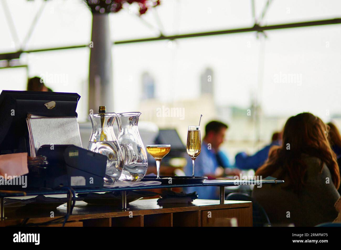 Cocktails and water jugs in restaurant to be picked by a waiter Stock ...