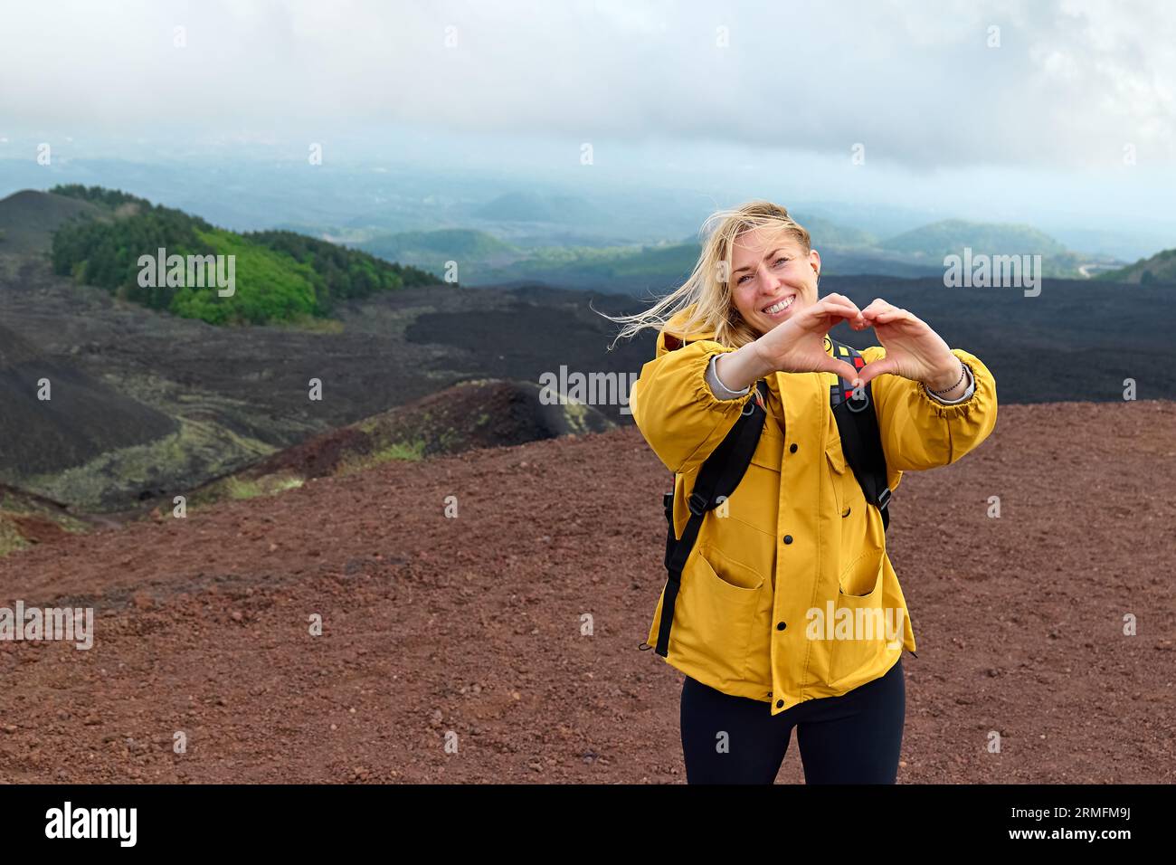 Hiking on tallest volcano in Continental Europe - Etna. Young smiling ...