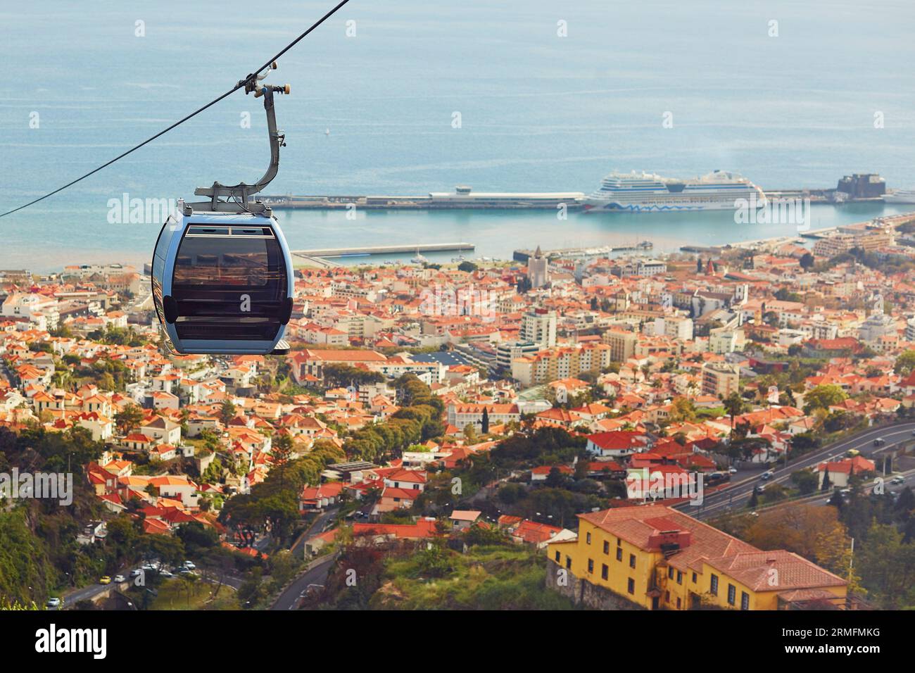Cable ropeway cabin over the town of Funchal, Madeira island, Portugal ...