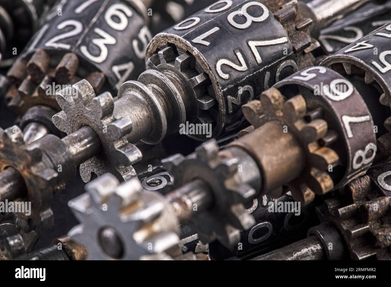 Metal gears and cogs mechanism with numbers Stock Photo - Alamy
