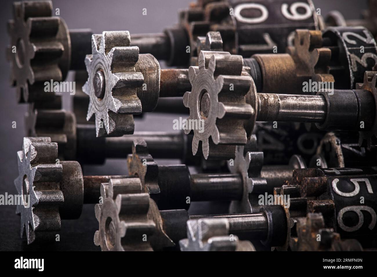 Metal gears and cogs mechanism with numbers Stock Photo - Alamy