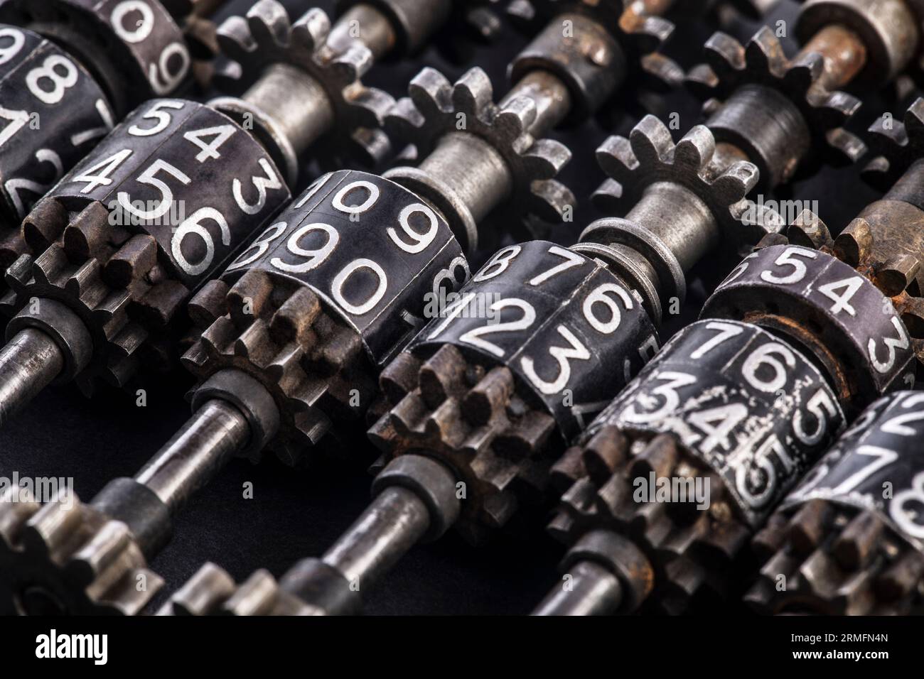 Metal gears and cogs mechanism with numbers Stock Photo - Alamy