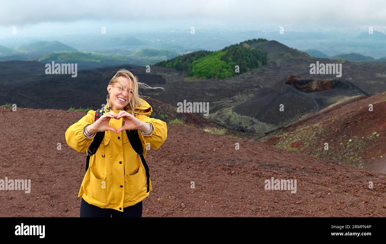 Hiking on tallest volcano in Continental Europe - Etna. Young smiling ...