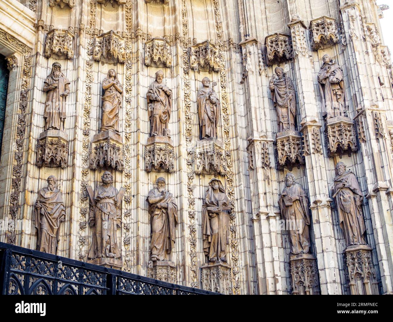Sculptures of apostles and saints located in the niches on a side of ...