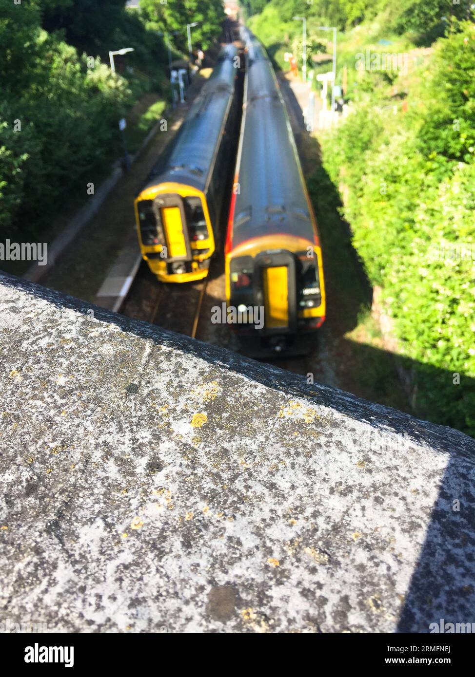 Trains passing under a granite bridge hi-res stock photography and ...