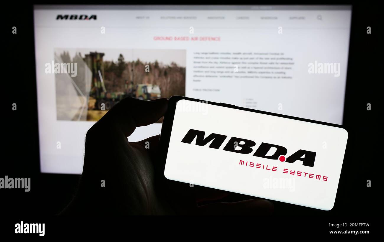 Person holding cellphone with logo of French missile systems company ...