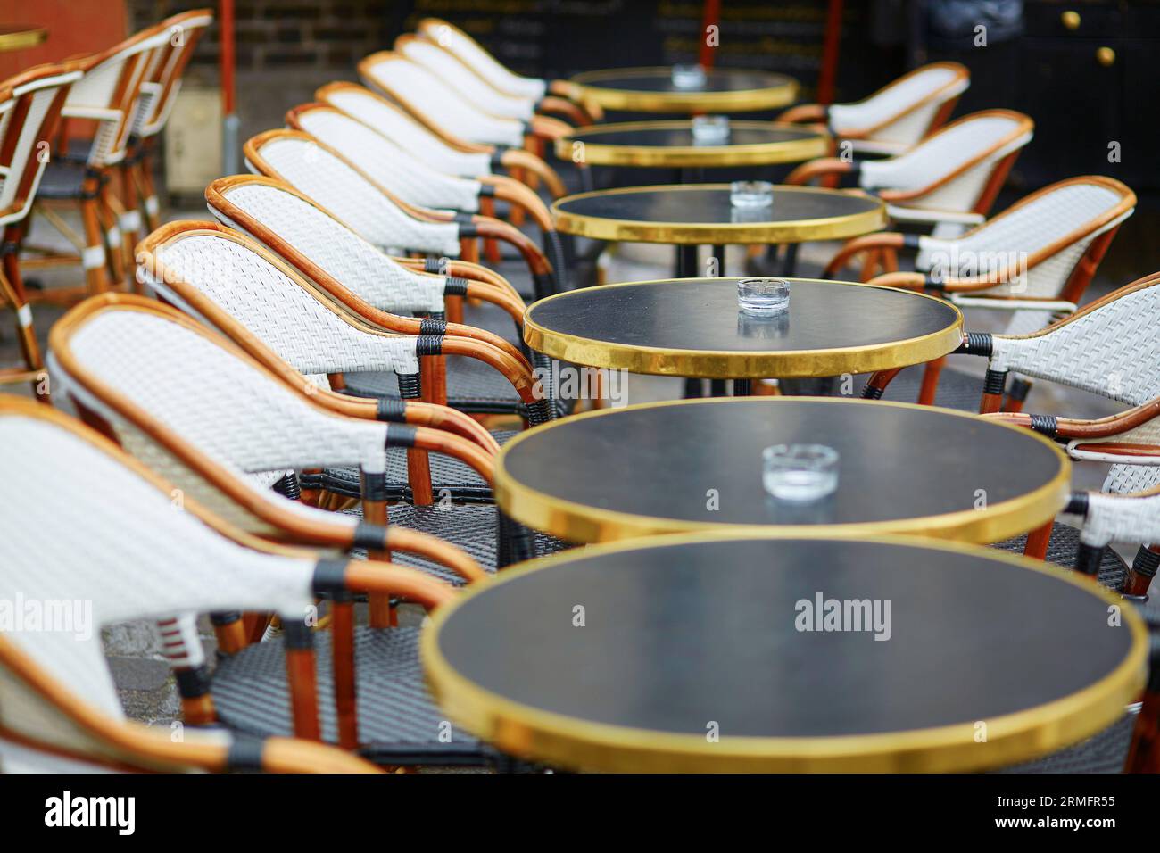 Tables of an empty Parisian outdoor cafe on Montmartre Stock Photo - Alamy