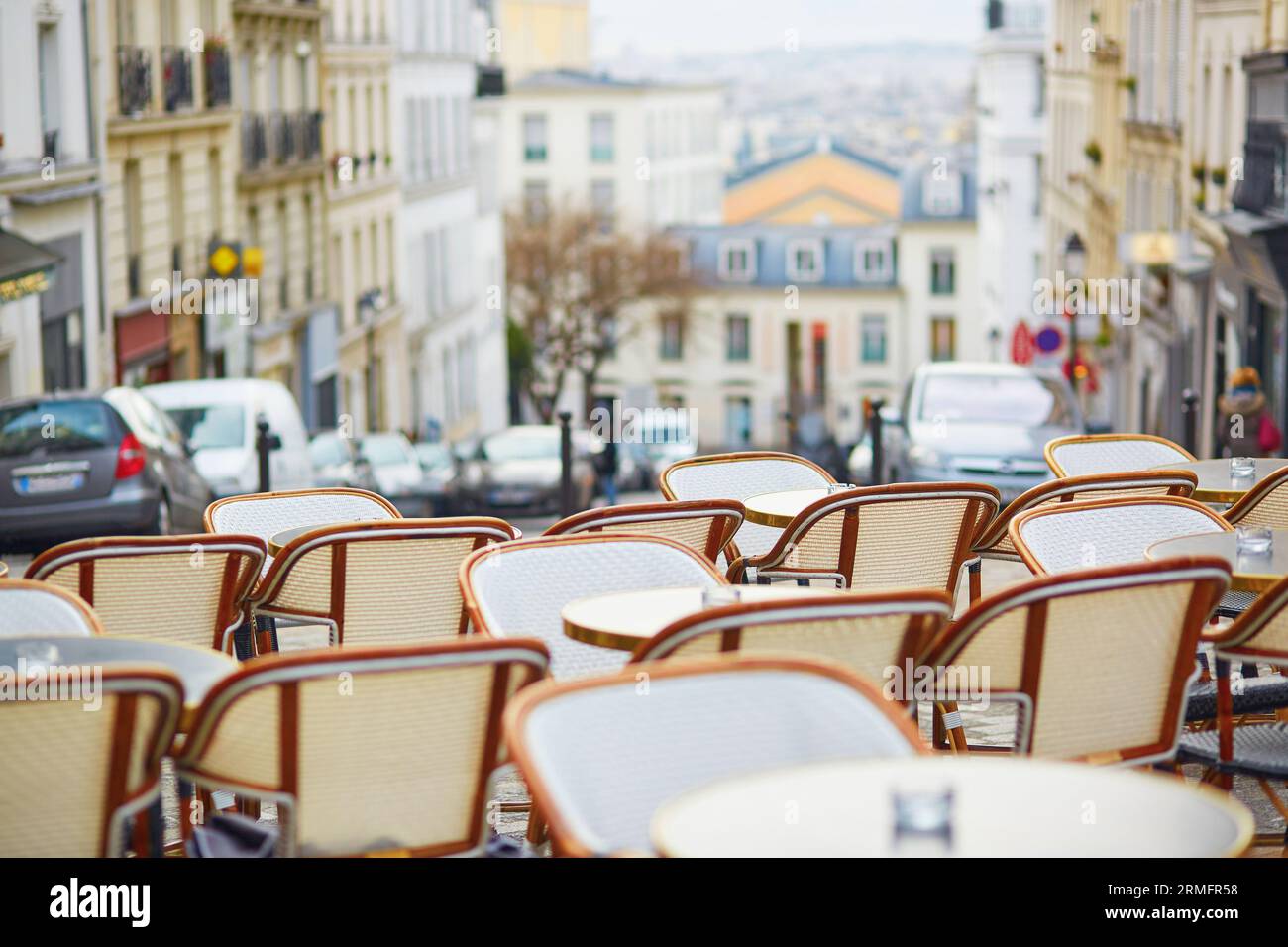 Tables of an empty Parisian outdoor cafe on Montmartre Stock Photo - Alamy