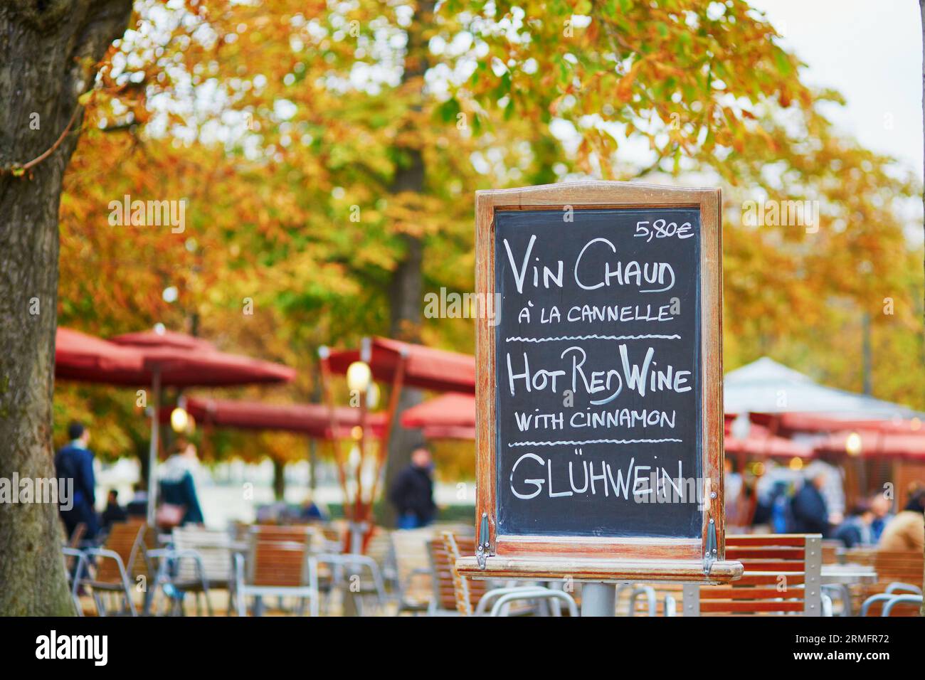 Menu board with words 'hot wine' in three languages in Parisian outdoor ...