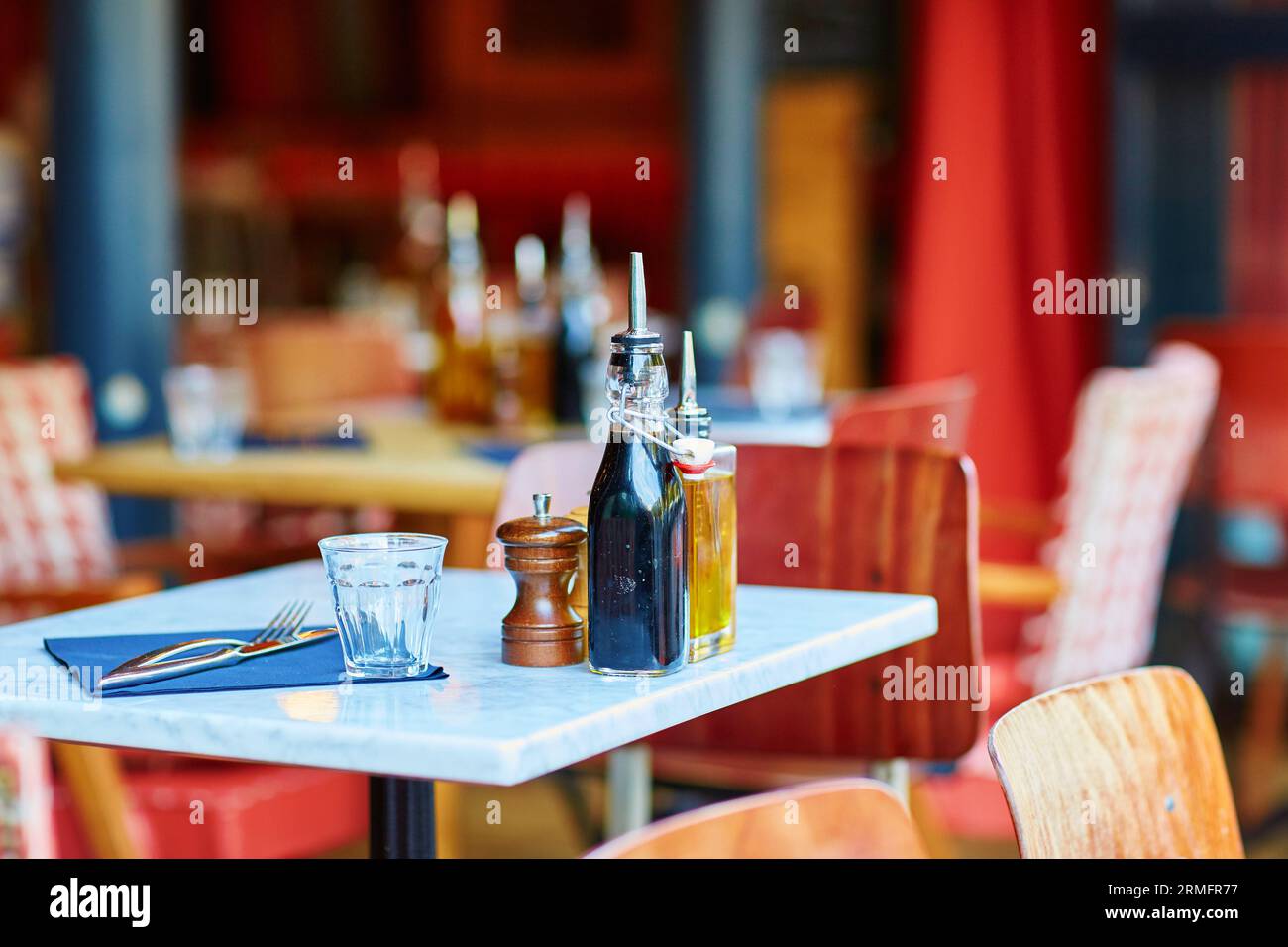 Tables of traditional outdoor French cafe in Paris Stock Photo - Alamy