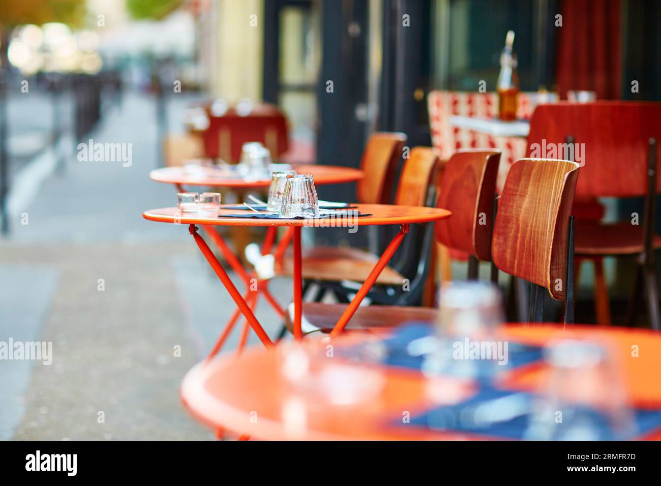 Tables of traditional outdoor French cafe in Paris Stock Photo - Alamy