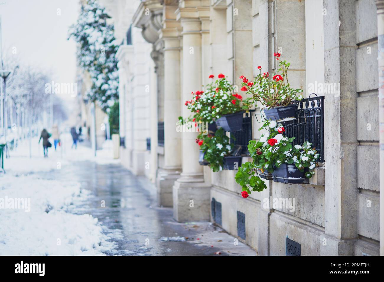 Heavy snowfall in Paris. Parisian street under the snow. Unusual ...