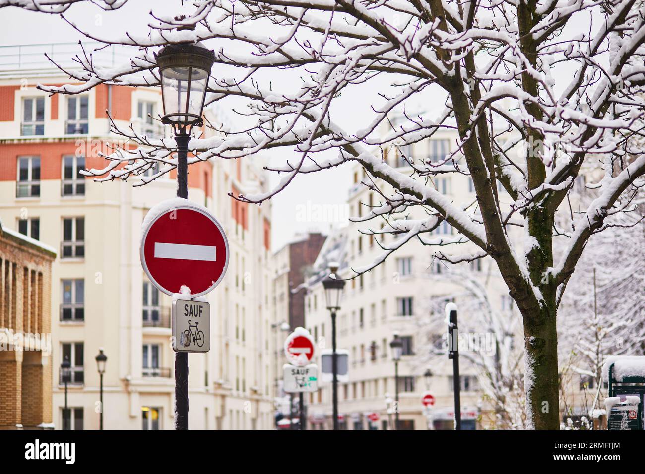 Heavy snowfall in Paris. Parisian street under the snow. Unusual ...