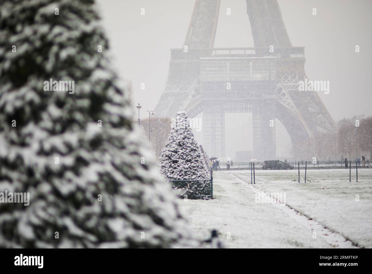 Scenic view to the Eiffel tower on a day with heavy snow. Unusual ...