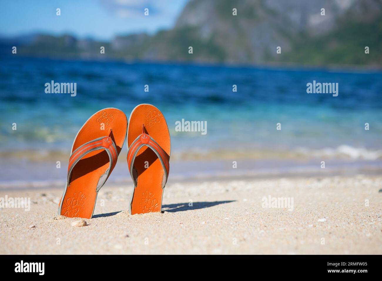 Slippers on sand beach near the water Stock Photo - Alamy