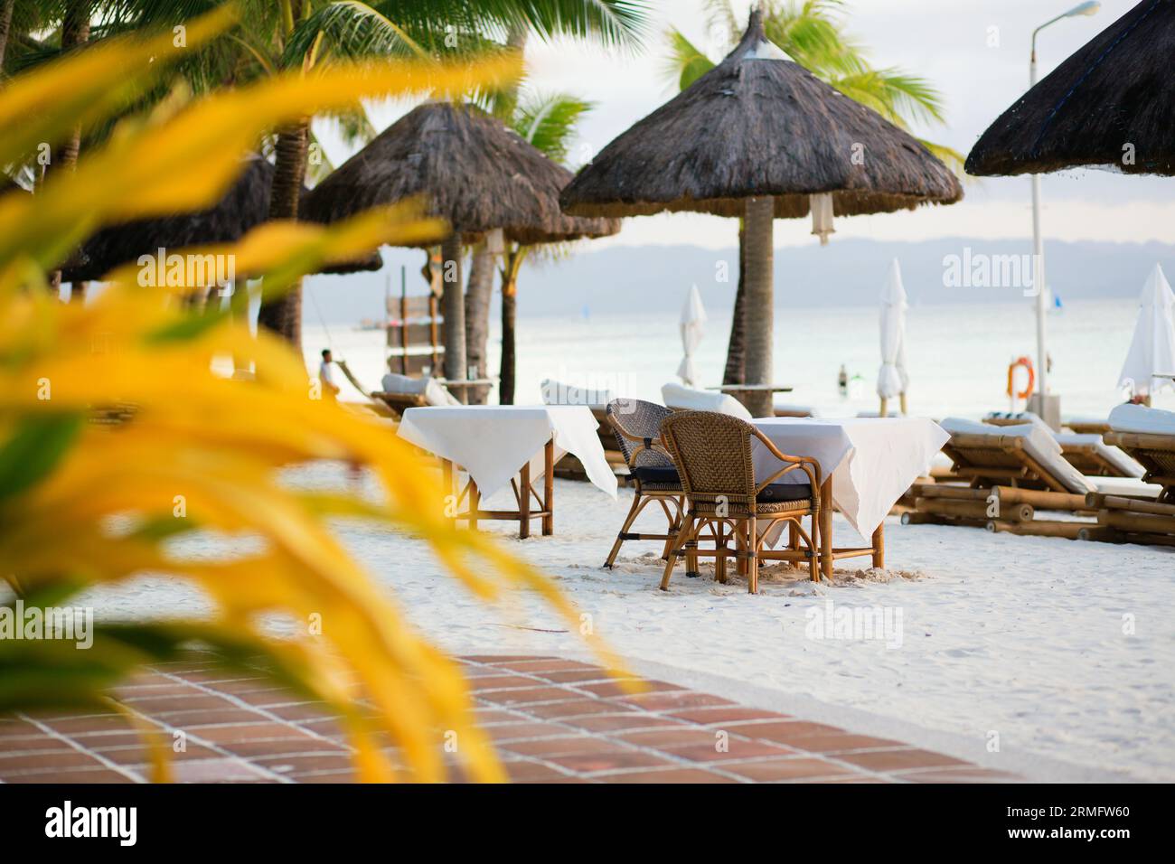 Outdoor restaurant tables on perfect white sand tropical beach Stock ...