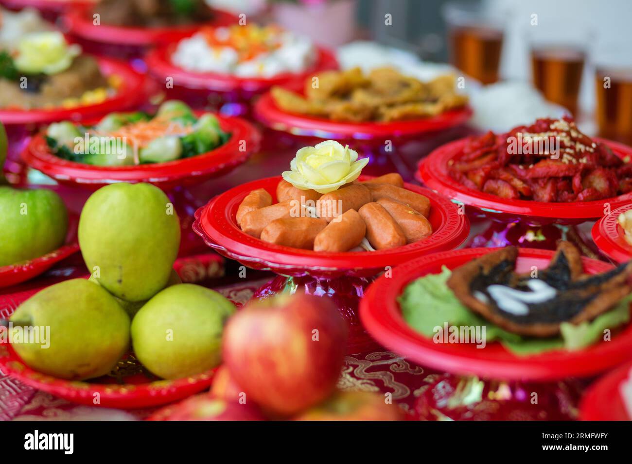 Food plates near the Chinese temple in Singapore, prepared for the ...