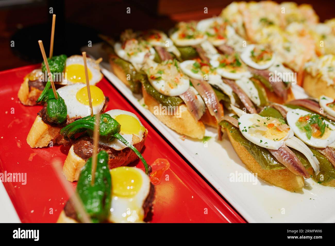 Variety of pinchos (pintxos) in a bar of San Sebastian (Donostia ...