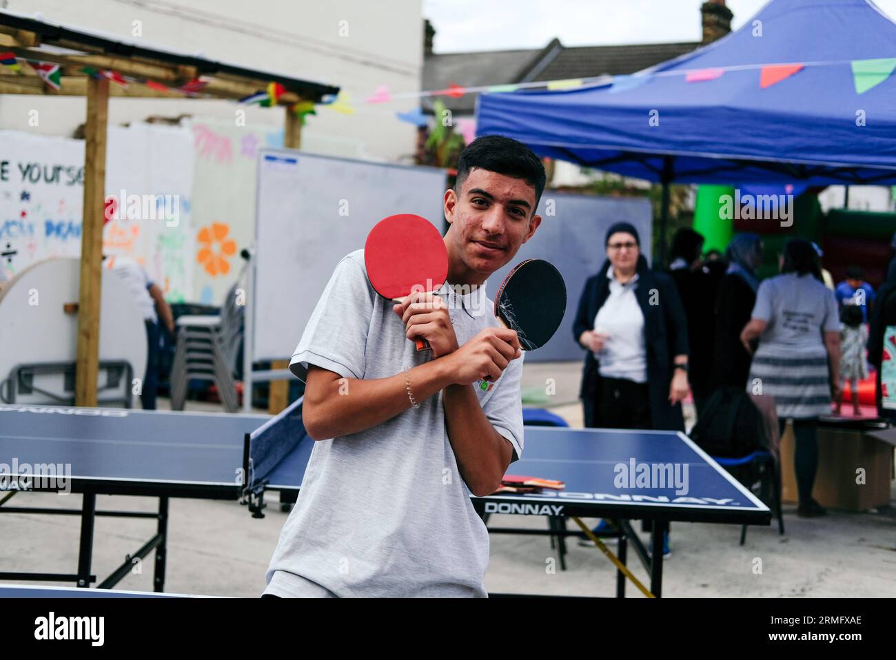 London, UK. 28th August 2023. Volunteers lead a community space, with ...