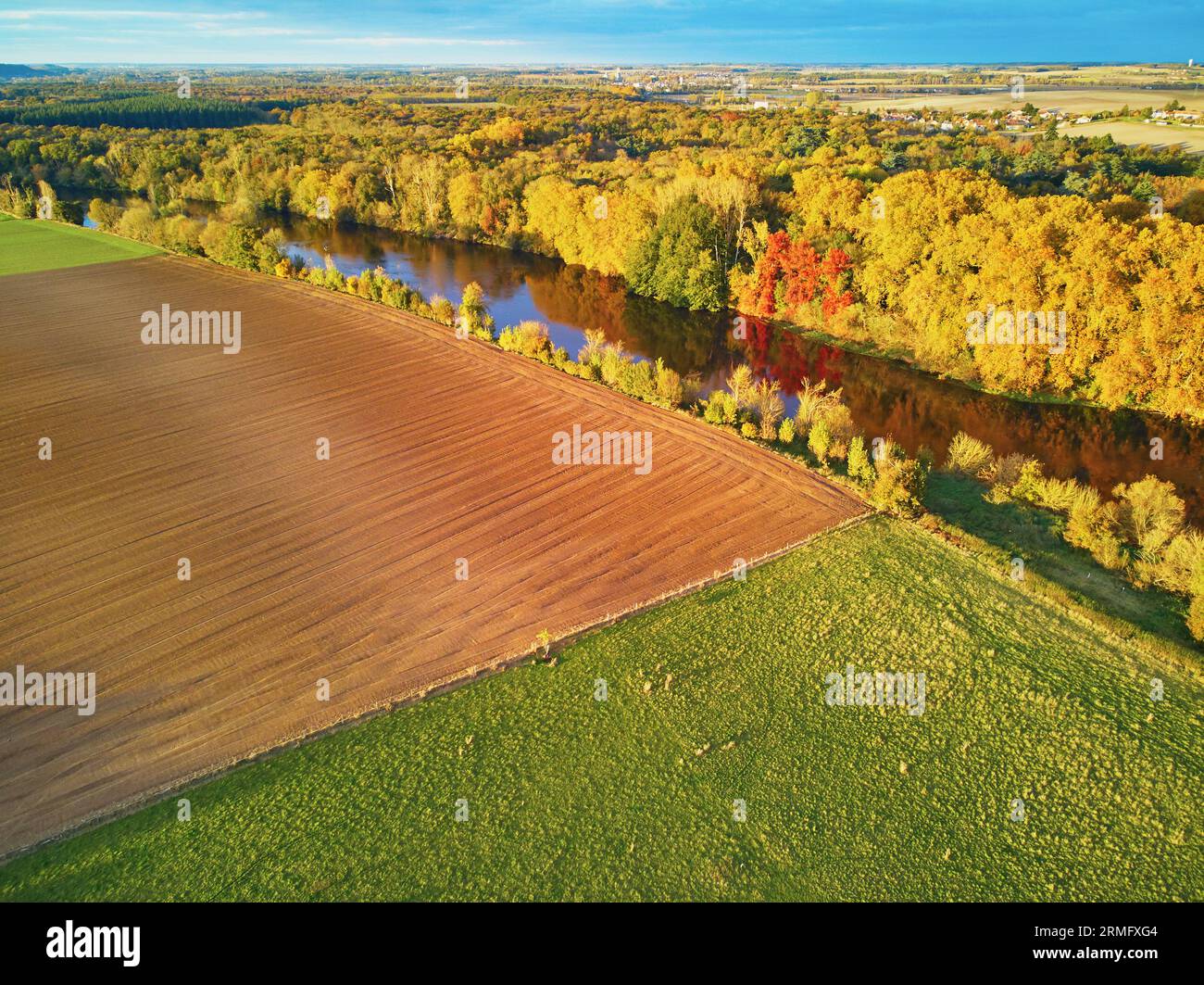 Scenic view of autumn forest and river Vienne near medieval castle of Les Ormes, France Stock ...