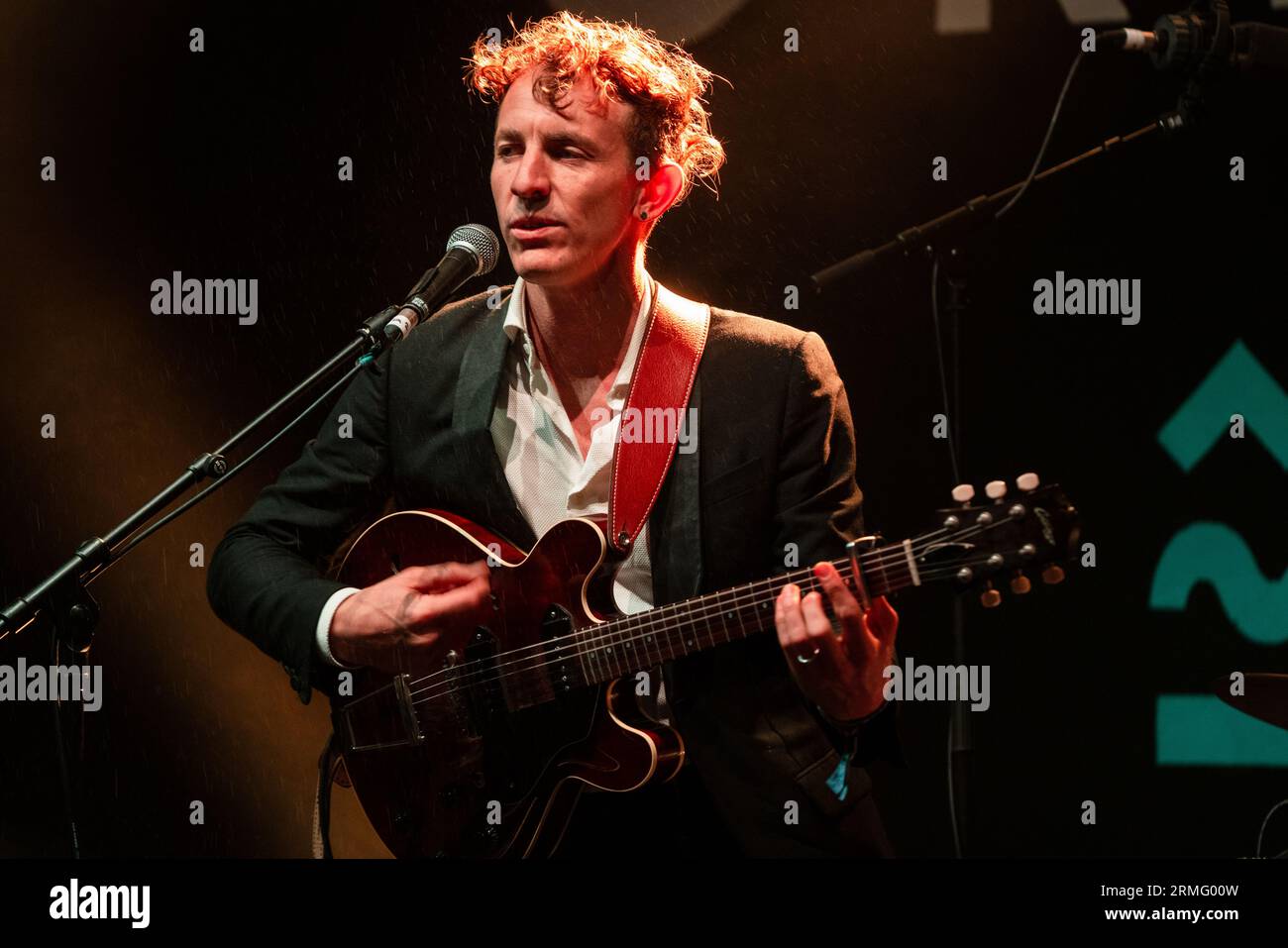 Buck Meek, guitarist with Big Thief, playing solo in heavy rain at ...