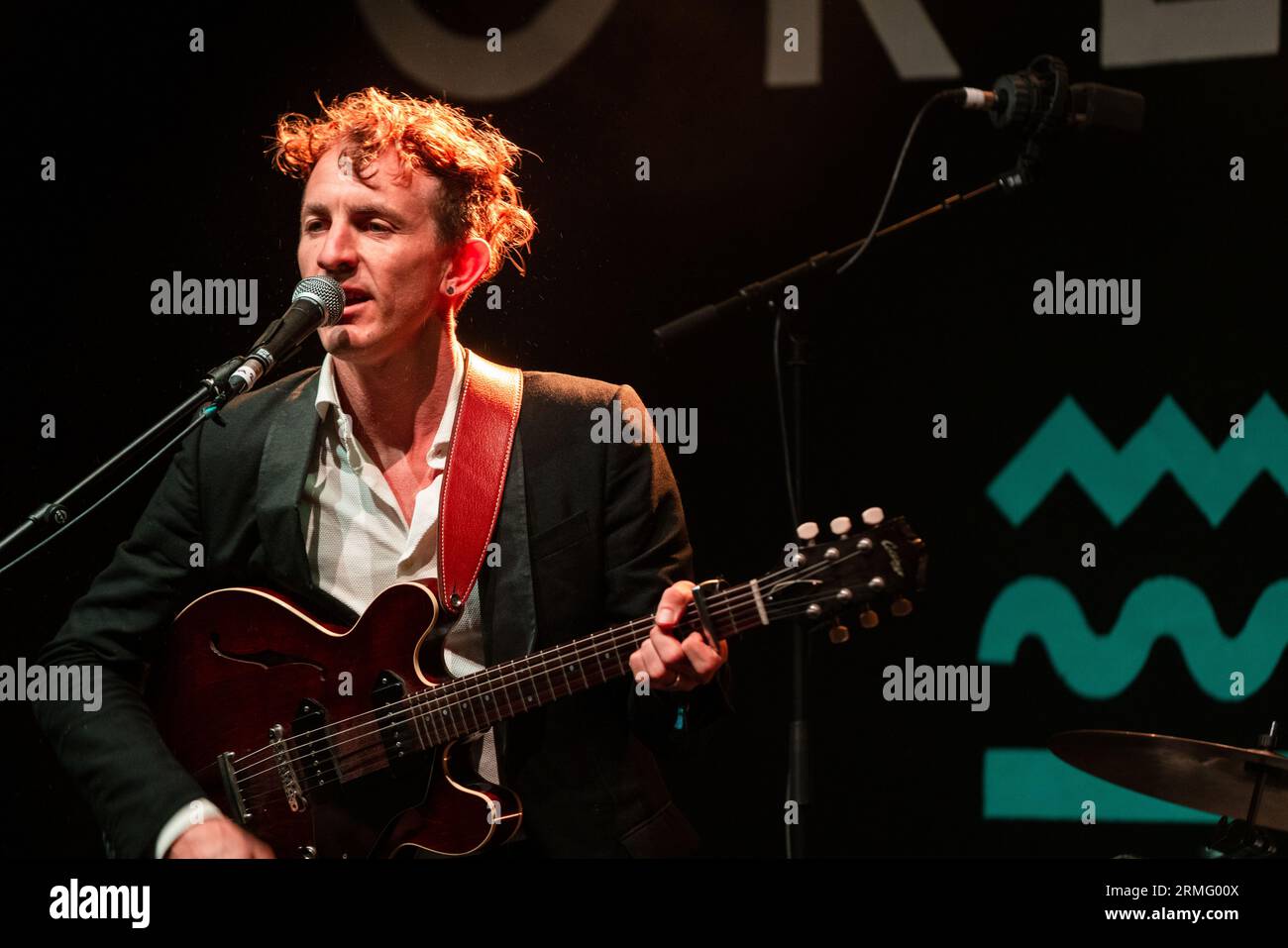 Buck Meek, guitarist with Big Thief, playing solo in heavy rain at ...