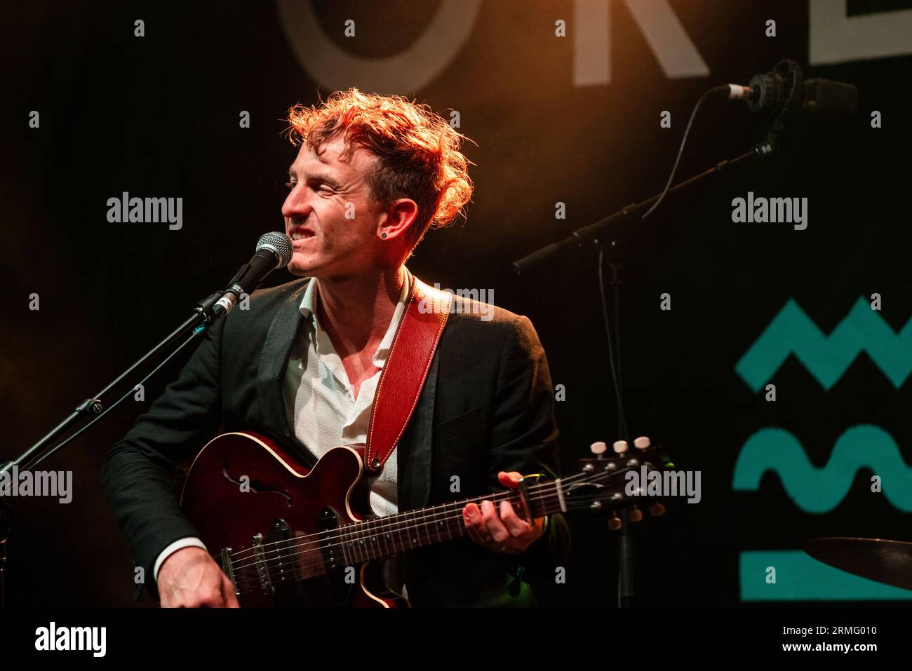 Buck Meek, guitarist with Big Thief, playing solo in heavy rain at ...