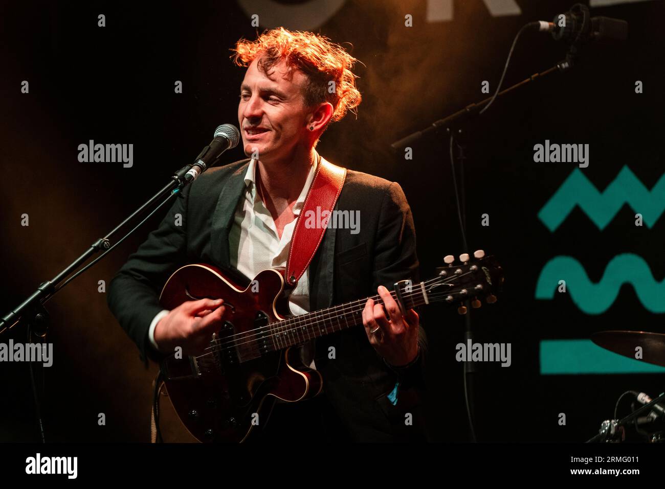 Buck Meek, guitarist with Big Thief, playing solo in heavy rain at ...