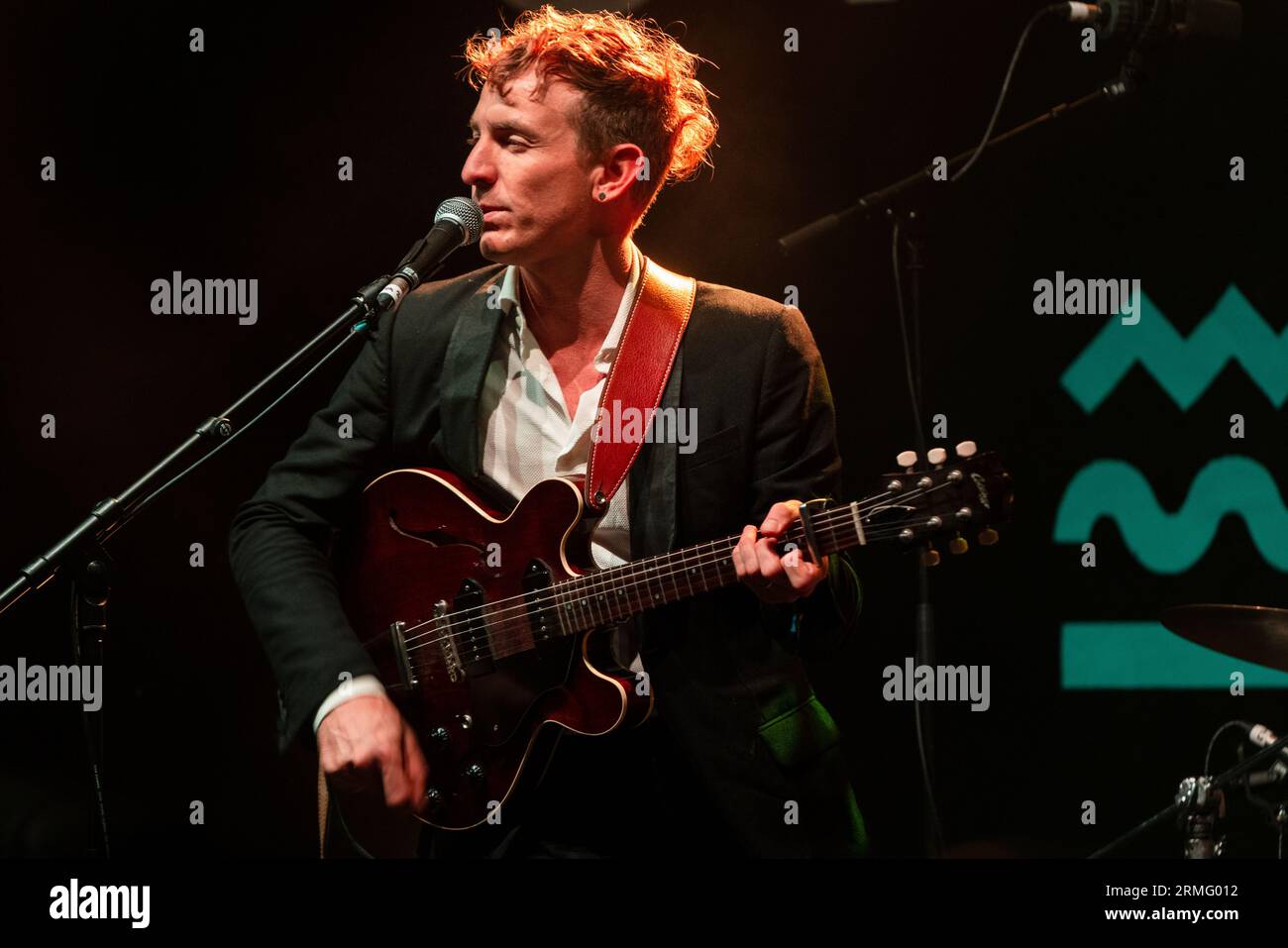 Buck Meek, guitarist with Big Thief, playing solo in heavy rain at ...