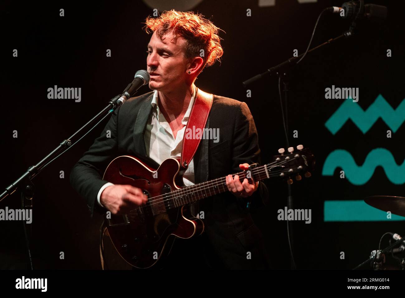 Buck Meek, guitarist with Big Thief, playing solo in heavy rain at ...