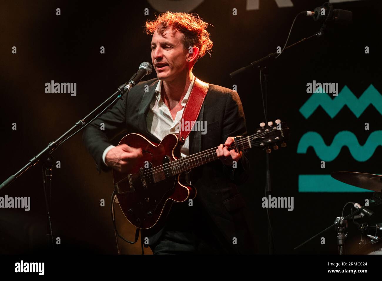Buck Meek, guitarist with Big Thief, playing solo in heavy rain at ...