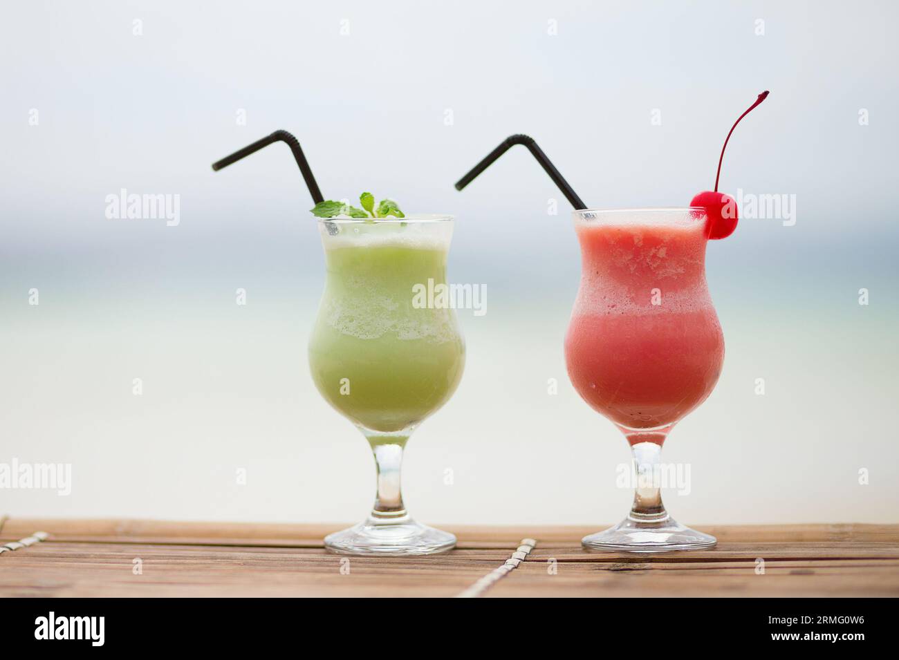 Two fresh fruit juices on a tropical beach Stock Photo - Alamy