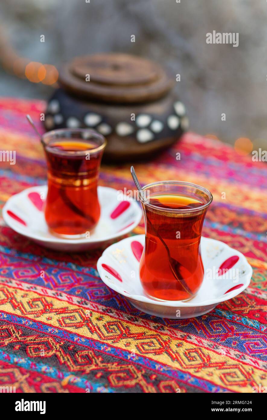 Black Turkish tea in traditional glasses Stock Photo - Alamy
