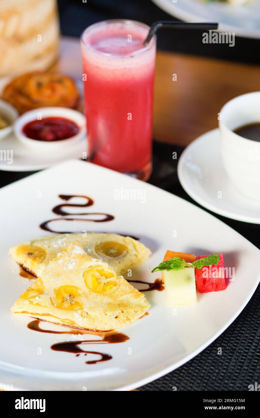 Traditional Balinese banana pancake and fresh watermelon juice Stock ...