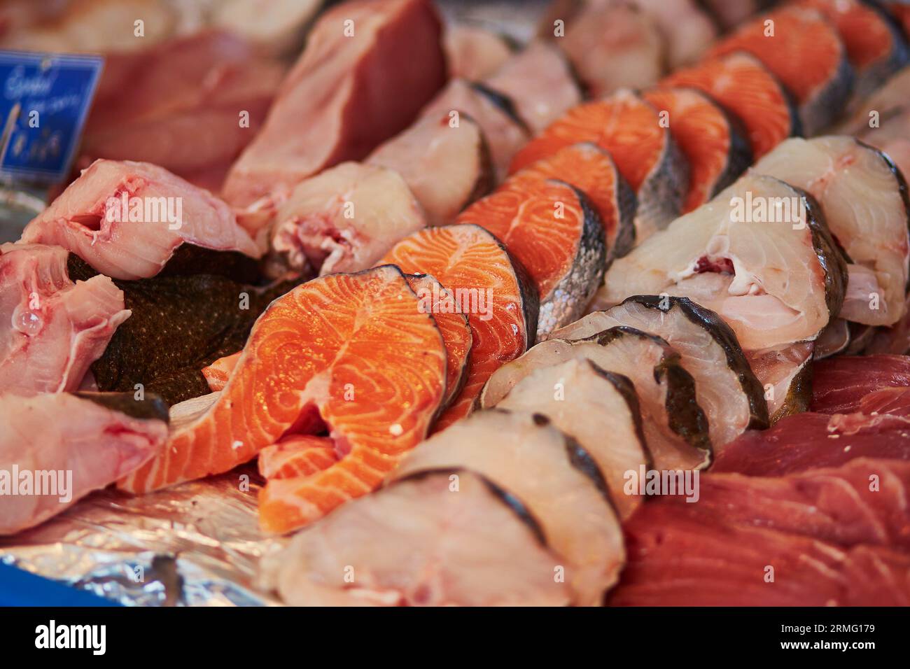 Salmon and tuna slices on farmers market in Paris, France Stock Photo ...