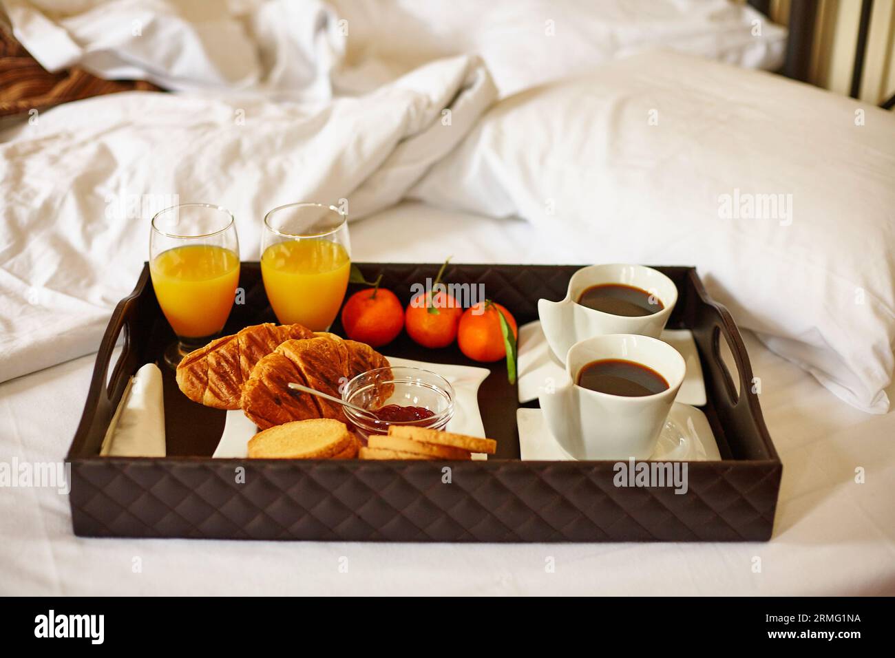 Delicious breakfast on tray in bed Stock Photo - Alamy