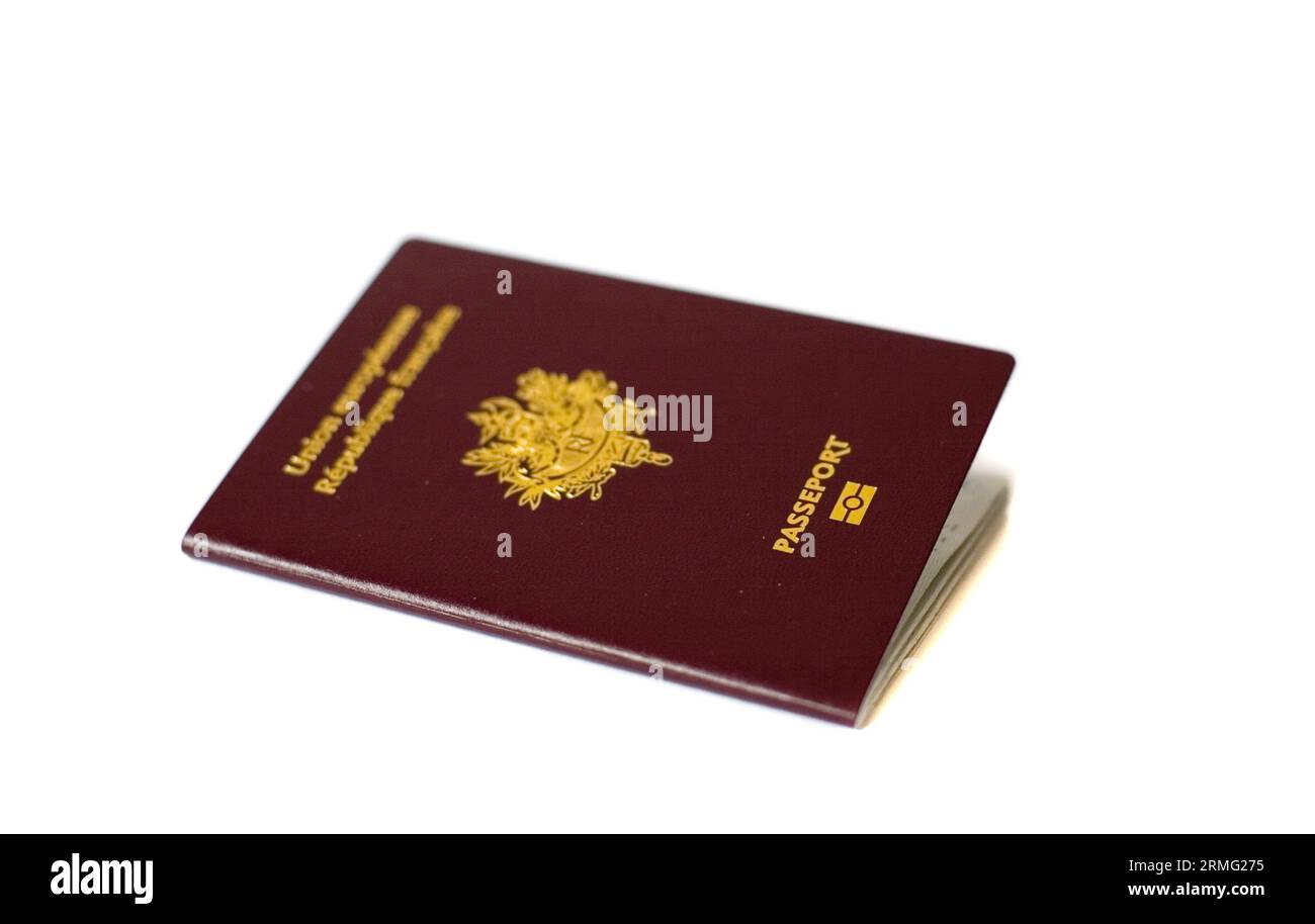 Closeup of French passport isolated on white. Focus on the word ...