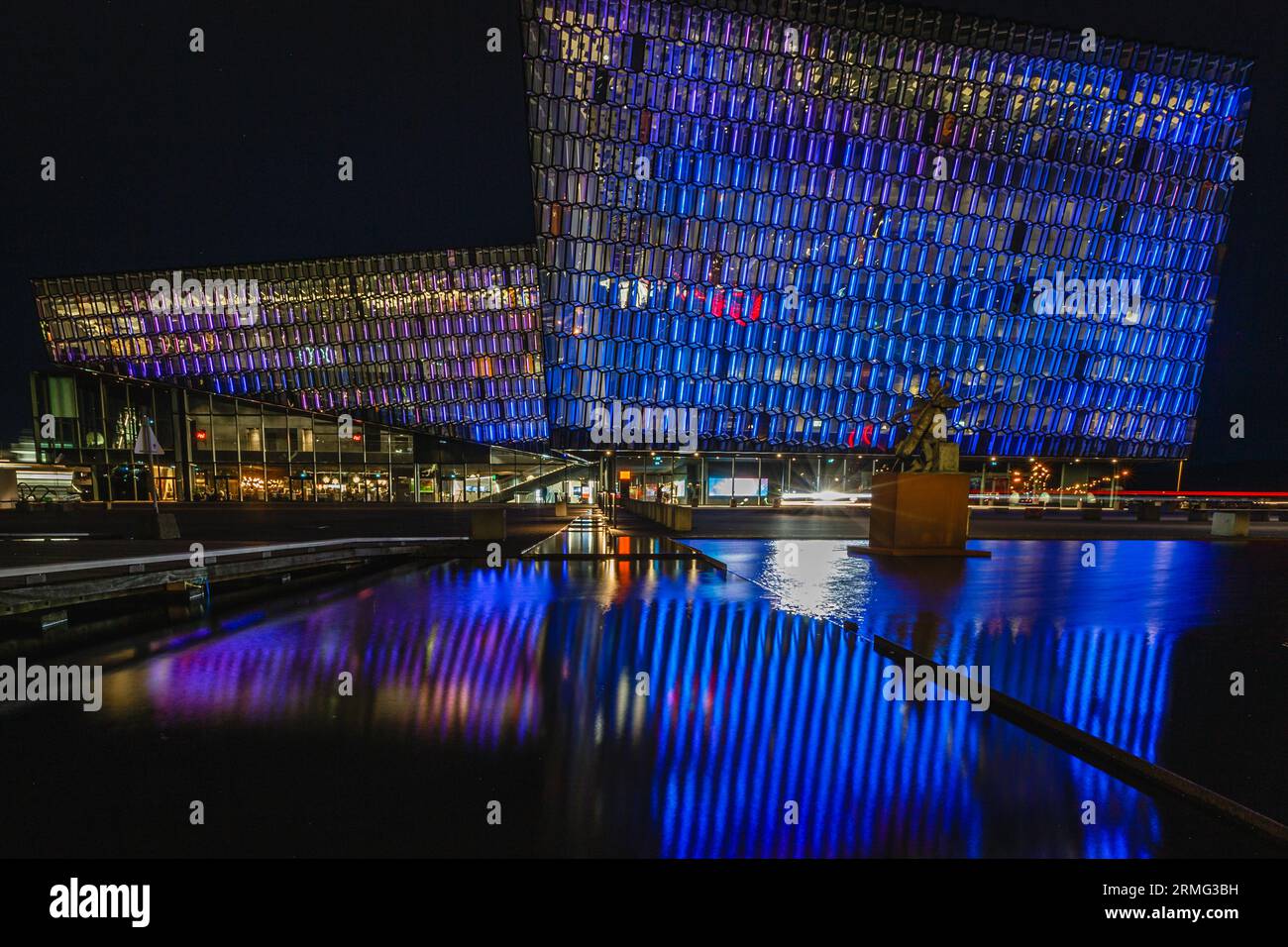 Harpa Concert Hall and Conference Centre reflects at night in Reykjavik ...