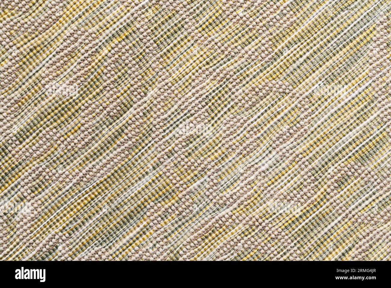 Multicolored woven rug with embossed pattern, which is canvas with ...