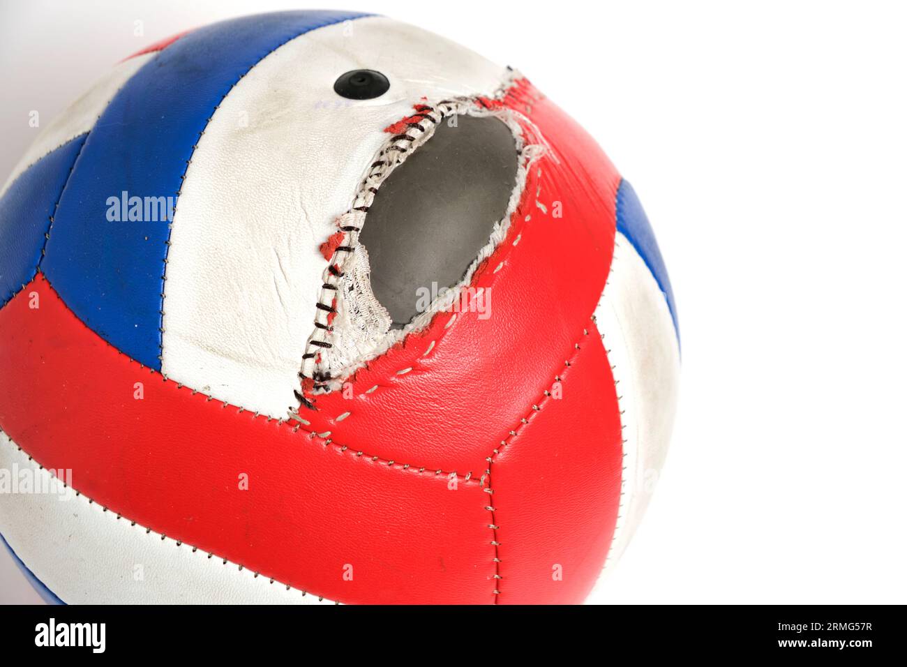 Torn soccer ball white background with hernia Stock Photo - Alamy