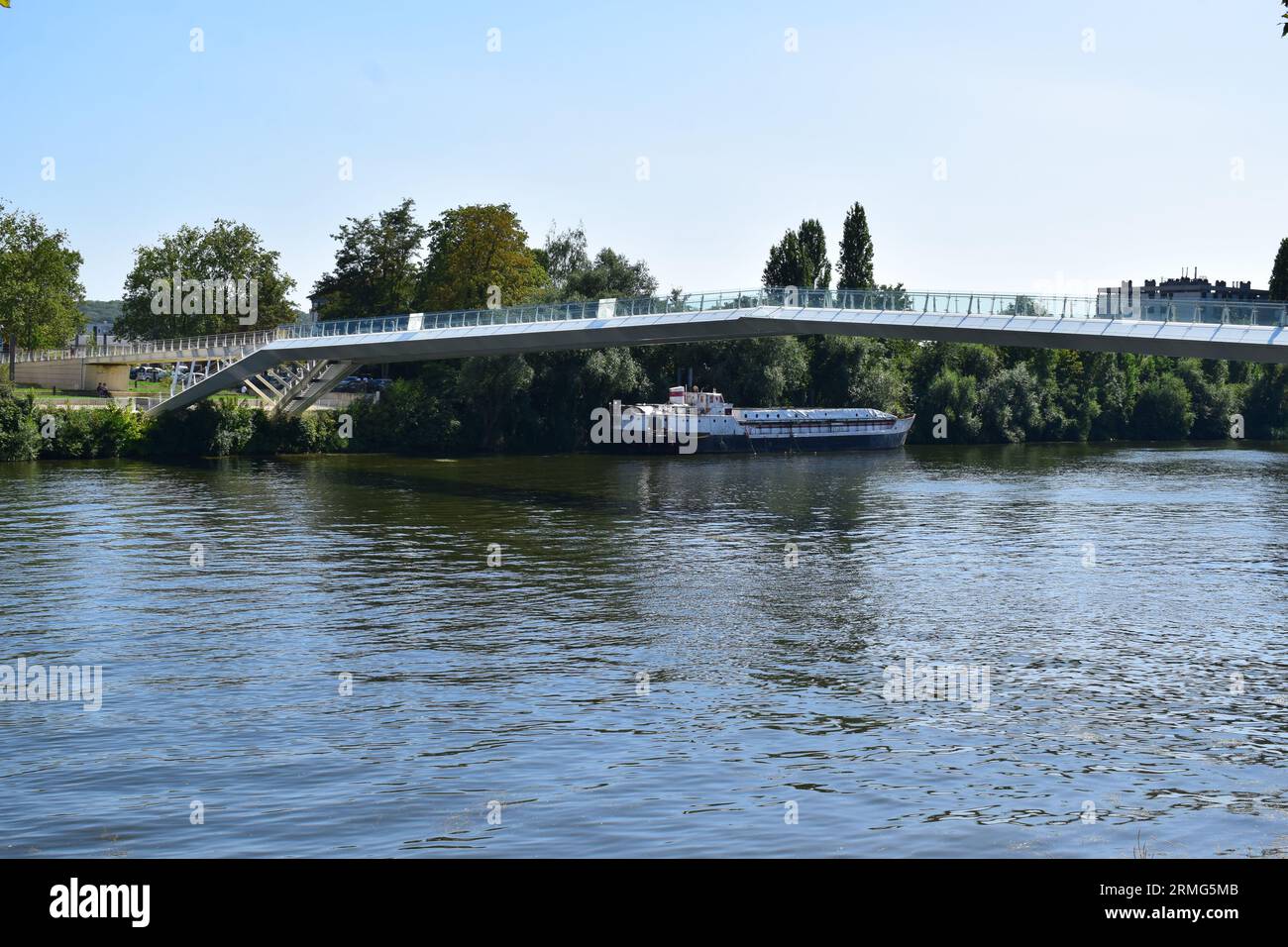 old ship under a modern bridge Stock Photo - Alamy