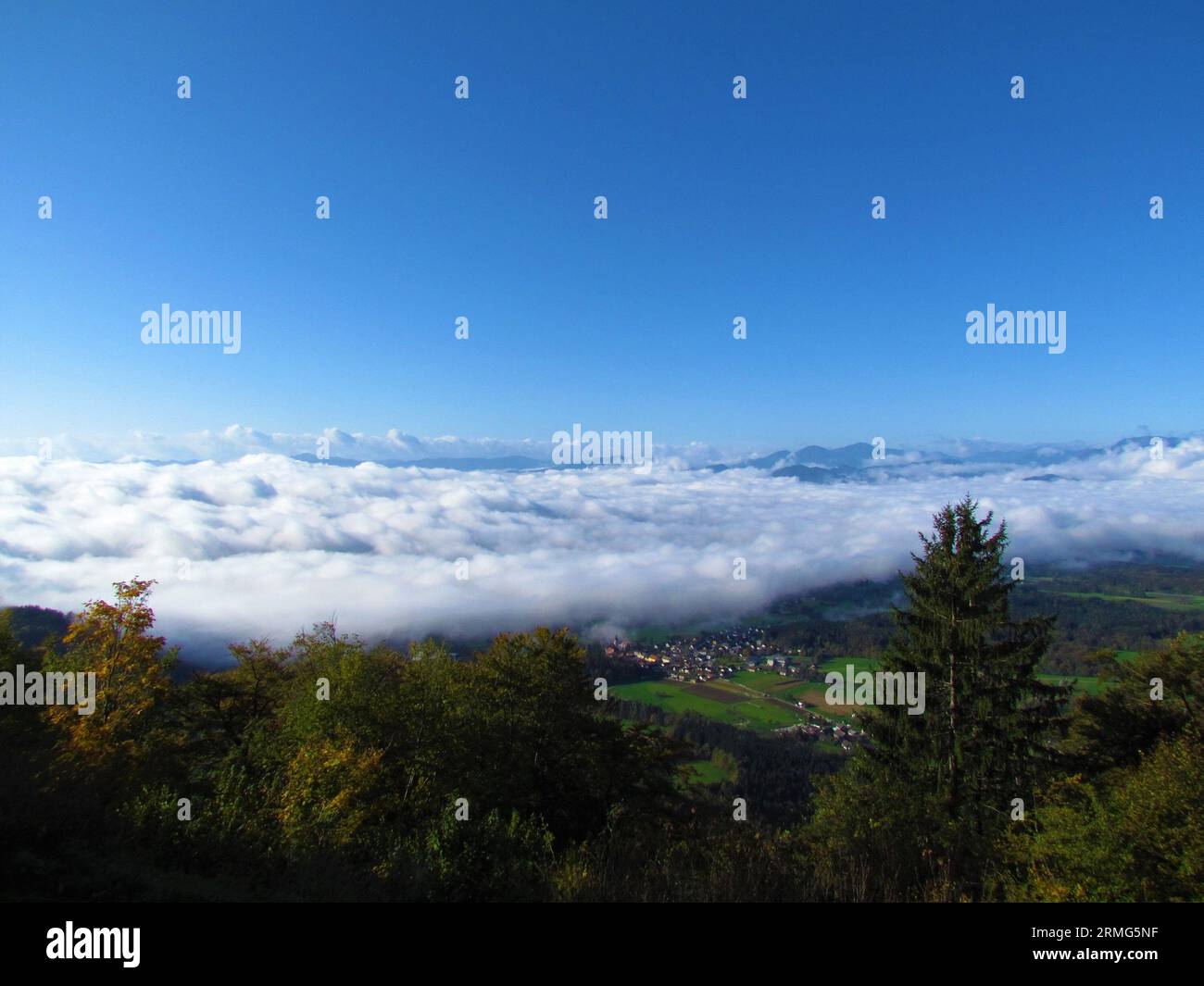View of Gorenjska region of Slovenia covered in white fluffy clouds ...