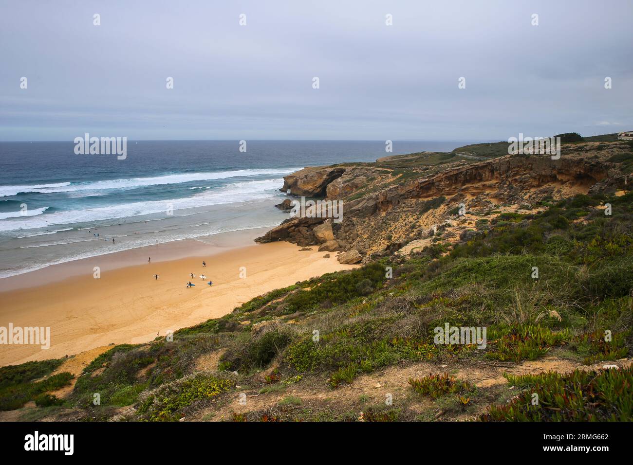 Beautiful Monte Clerigo Beach with rock formations on a cloudy day in ...