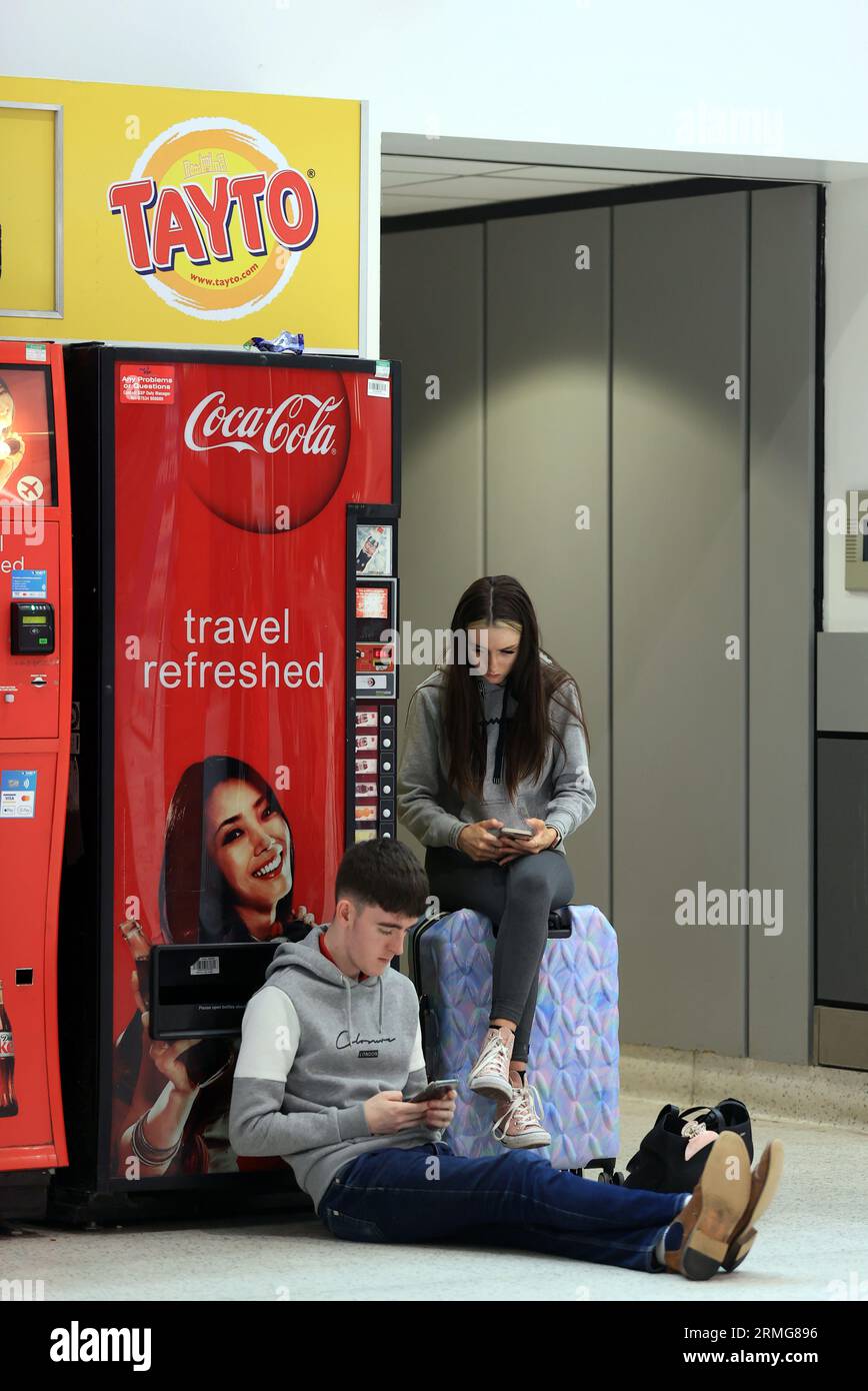 Passengers at Belfast International Airport, as flights to the UK and ...