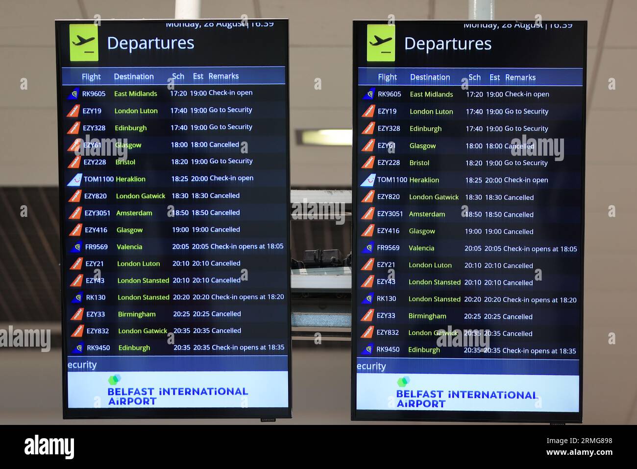 Departure boards at Belfast International Airport, as flights to the UK ...