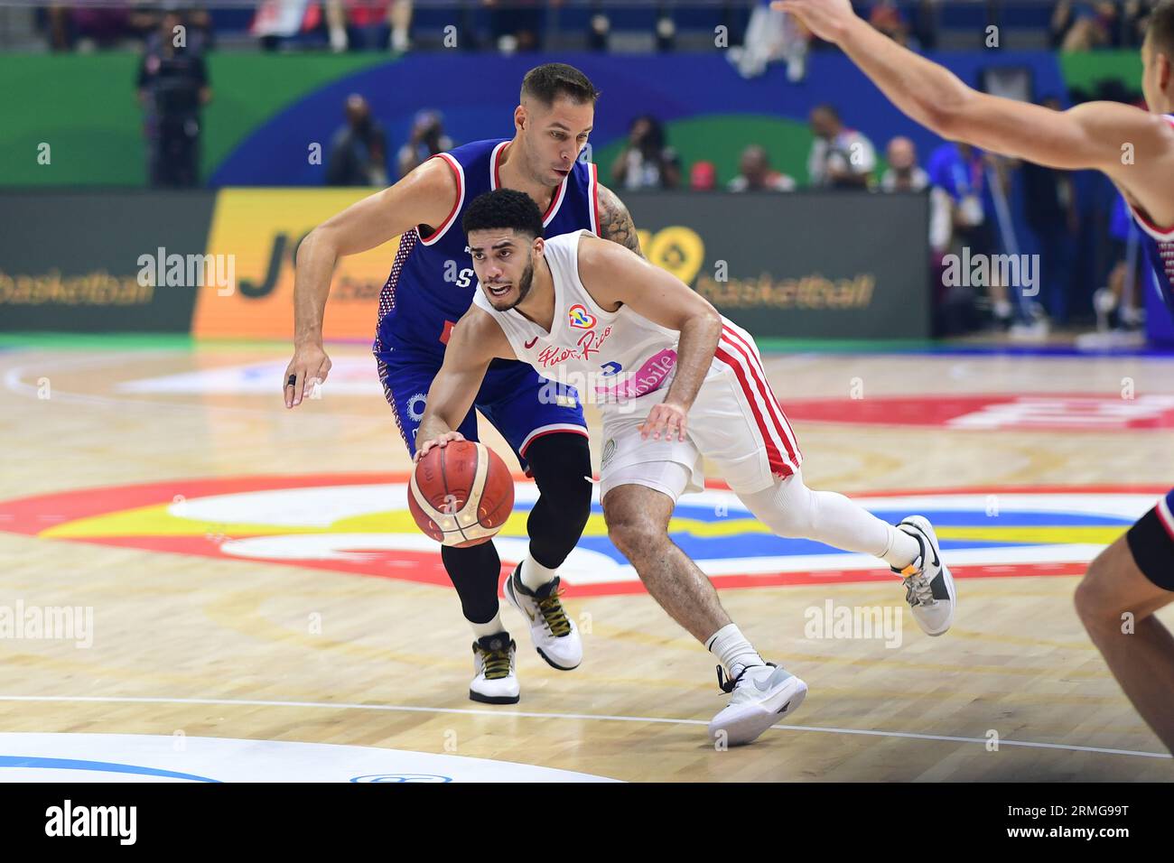 Quezon City, Philippines. 28th Aug, 2023. Jordan Howard (front) of Puerto Rico men basketball ...