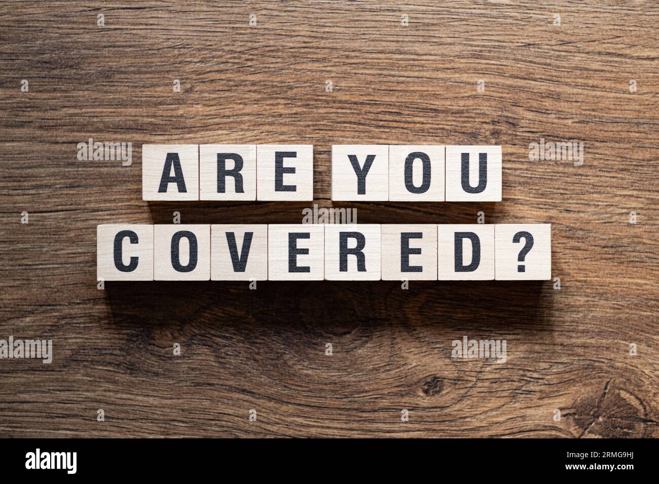 Are you covered - word concept on building blocks, text Stock Photo - Alamy