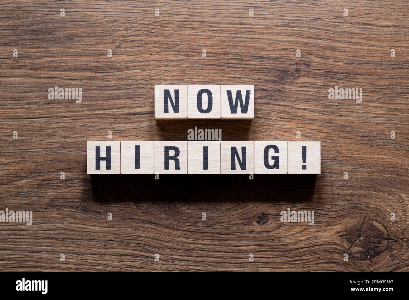 Now hiring - word concept on building blocks, text Stock Photo - Alamy